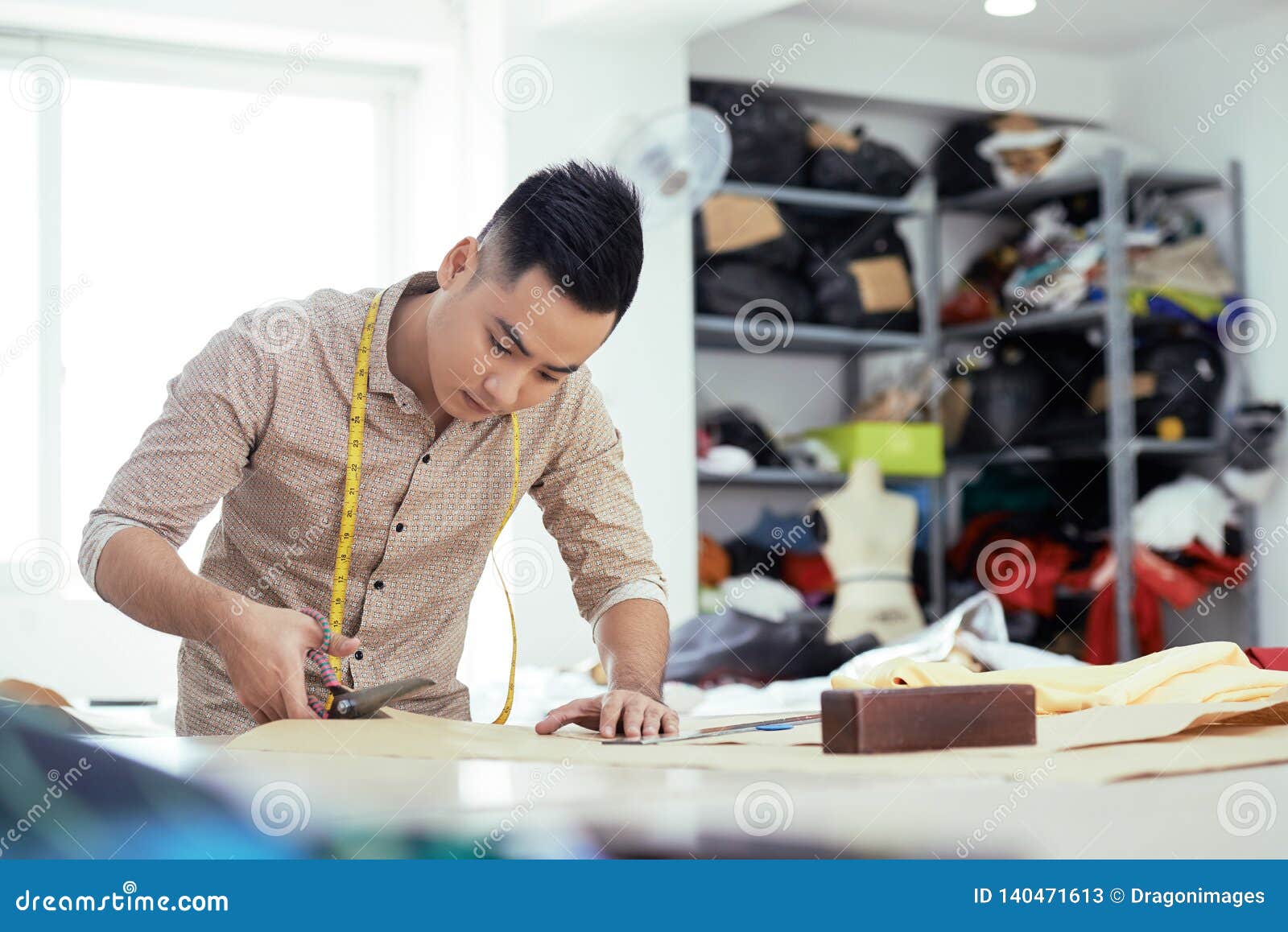Tailor making a new dress stock image. Image of atelier - 140471613