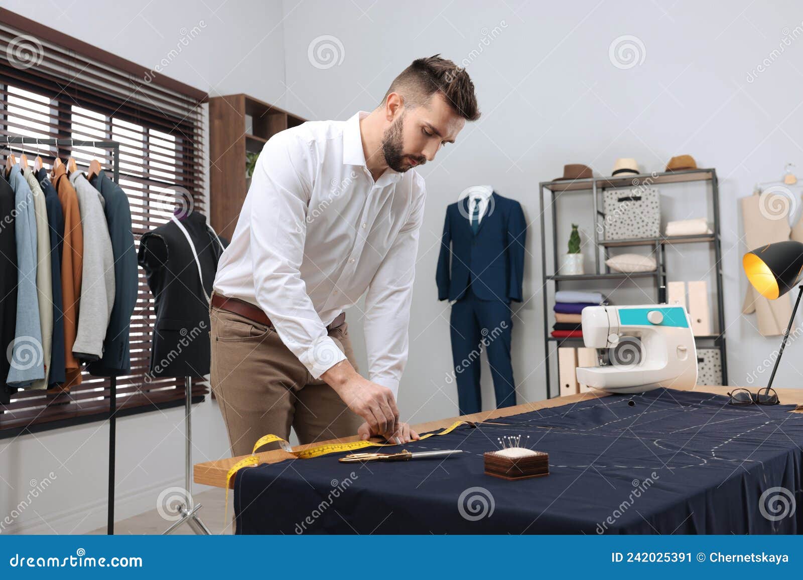 Tailor Marking Fabric with Chalk at Table in Workshop Stock Image ...