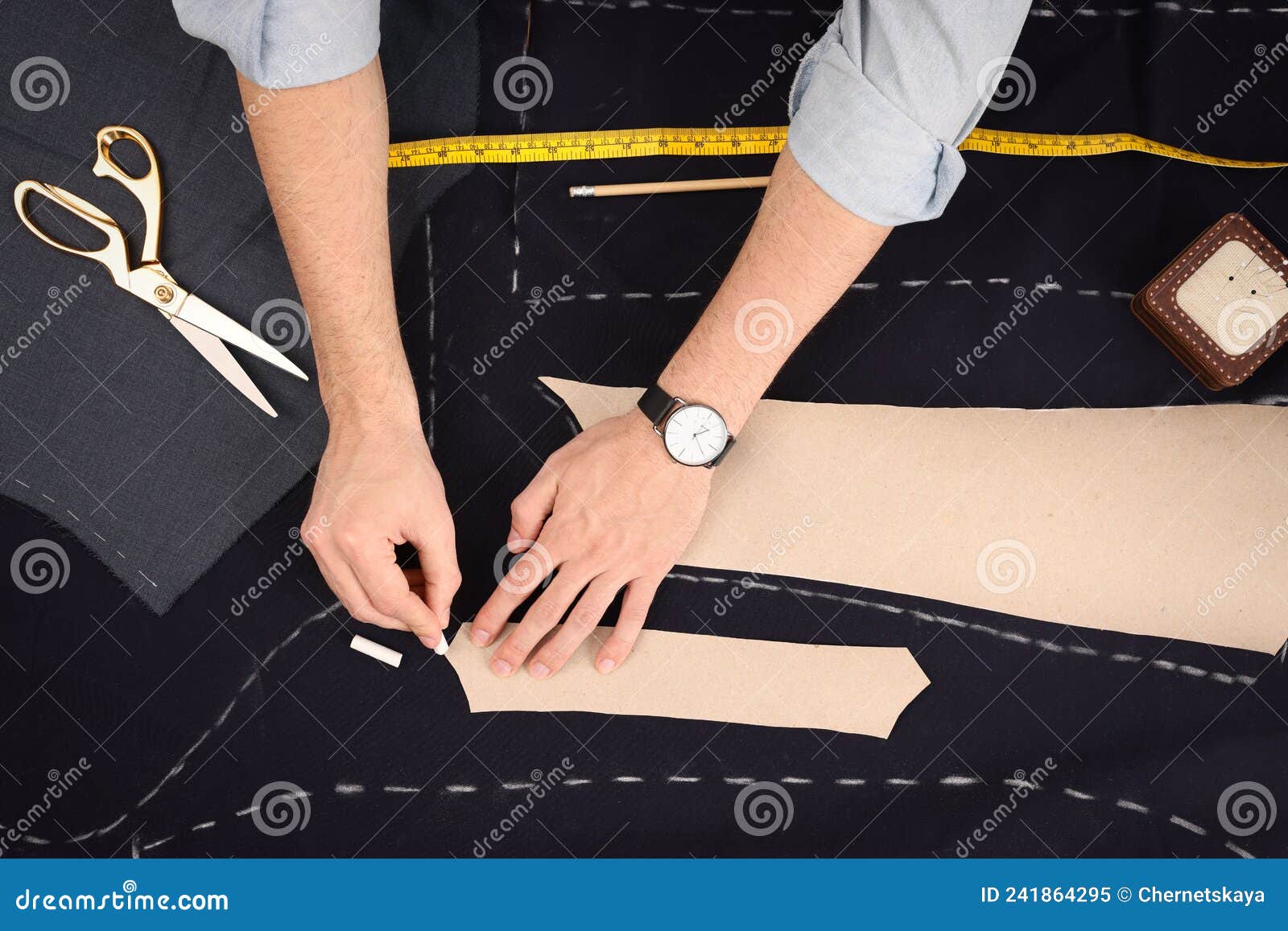 Tailor Marking Sewing Pattern on Fabric with Chalk at Table, Top View ...