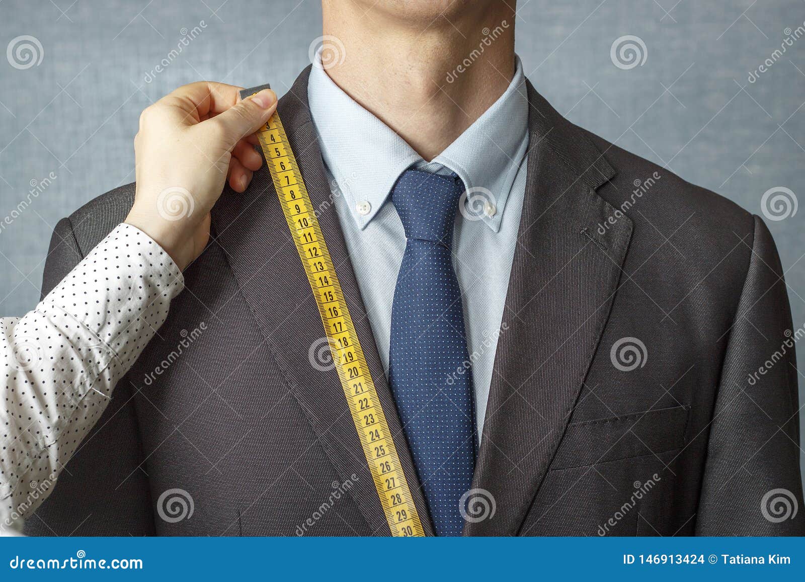 The Tailor Measures the Suit with a Measuring Tape Close-up Stock Photo ...
