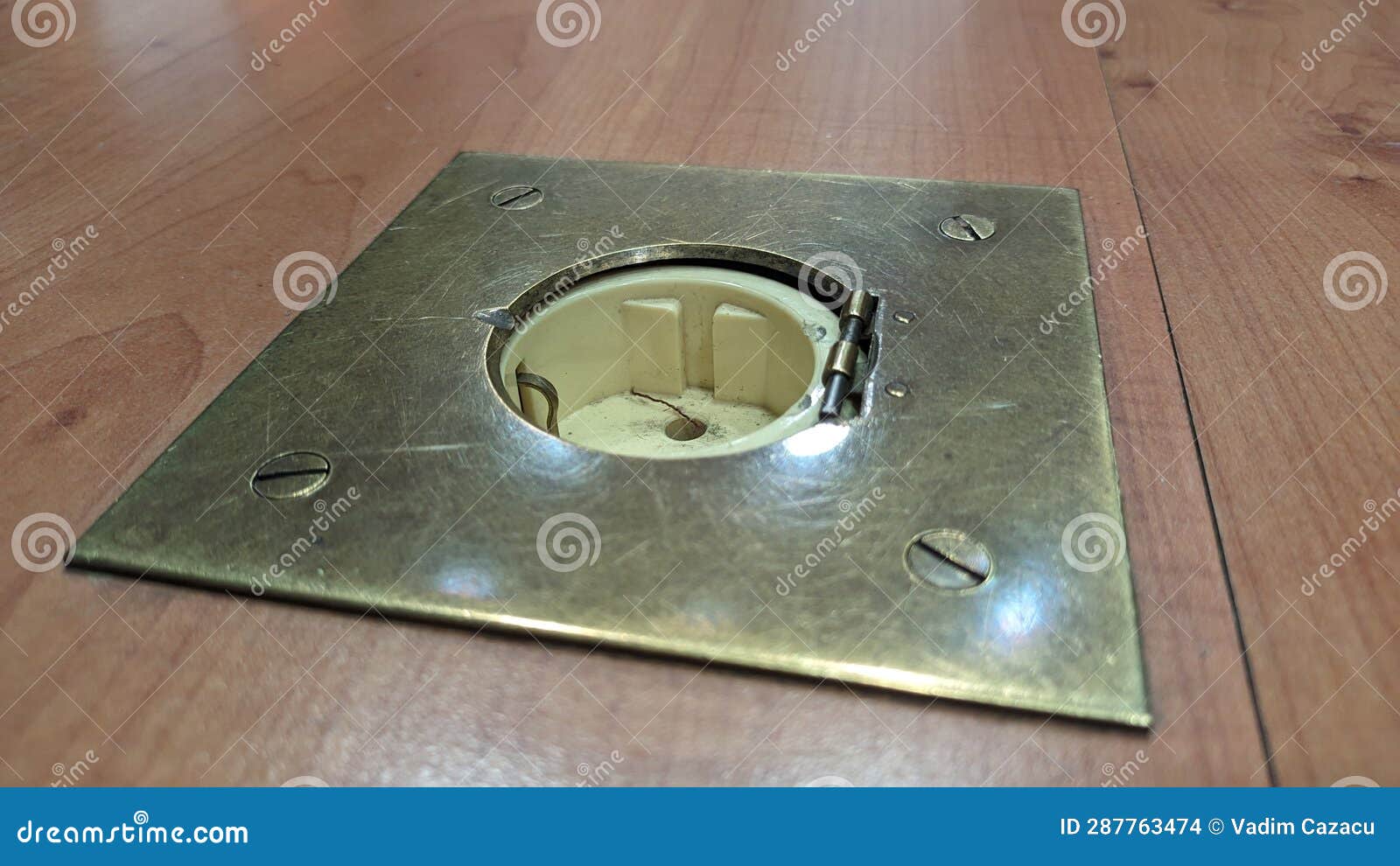 Electrical Outlet Made of Bronze Installed in the Floor in Wooden ...