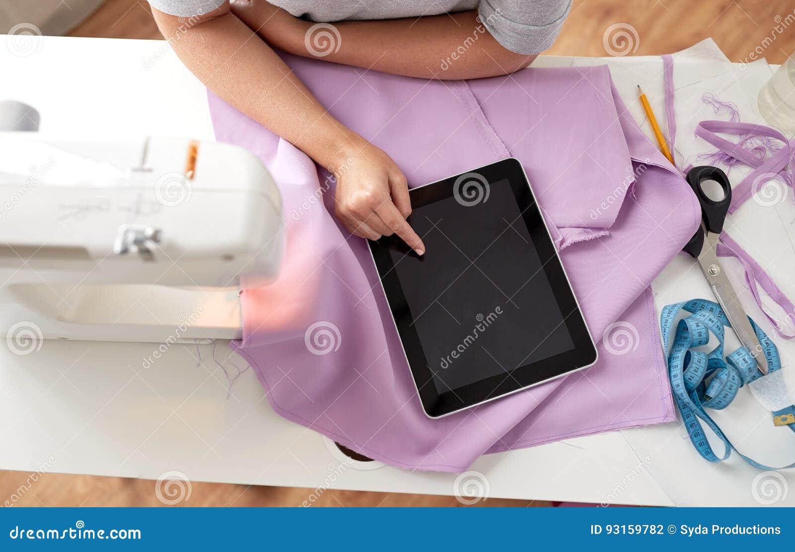 Tailor with Sewing Machine, Tablet Pc and Fabric Stock Photo - Image of ...