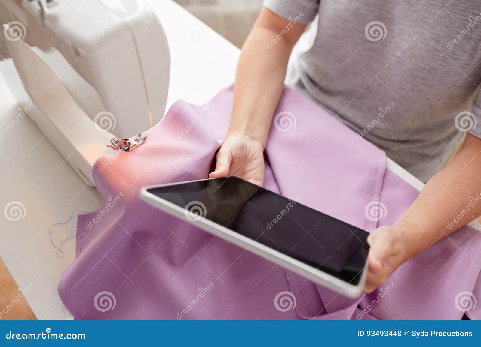 Tailor with Sewing Machine, Tablet Pc and Fabric Stock Photo - Image of ...