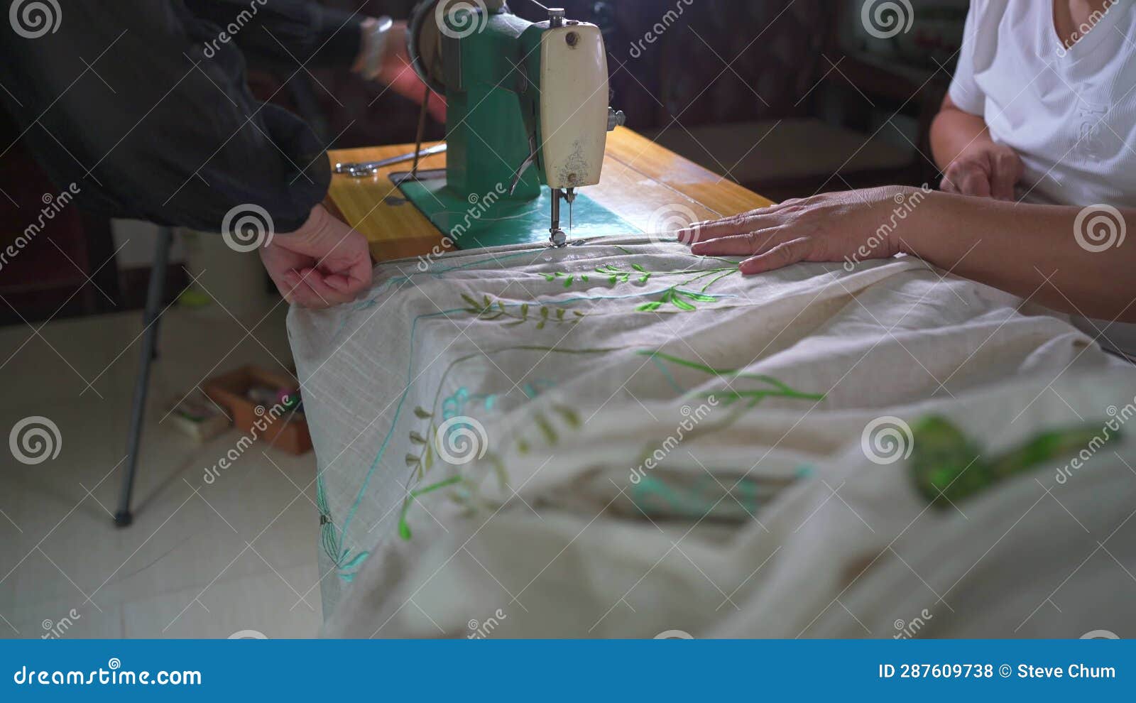 A Tailor Sews Curtains Using a Traditional Sewing Machine Stock Footage ...