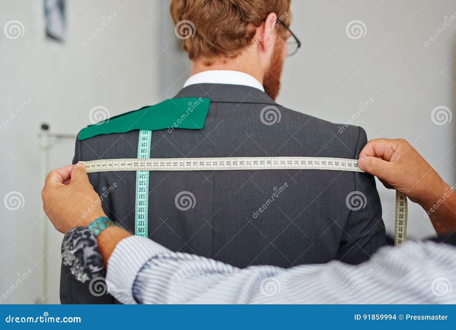 Tailor Taking Measurements on Customer Stock Photo - Image of model ...