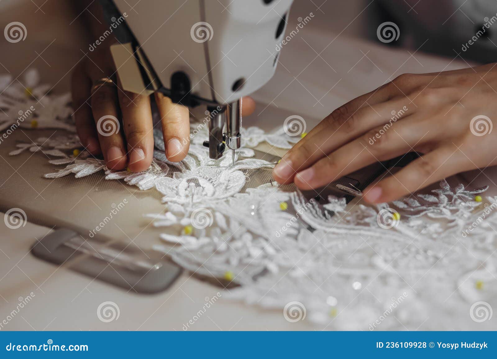 A Tailor is Using Machine for Perfecting the White Ornament Stock Photo ...