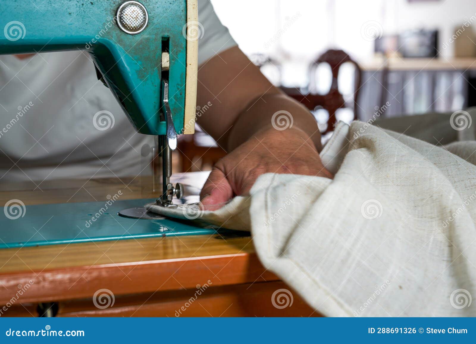 A Tailor Using a Traditional Household Sewing Machine Stock Photo ...