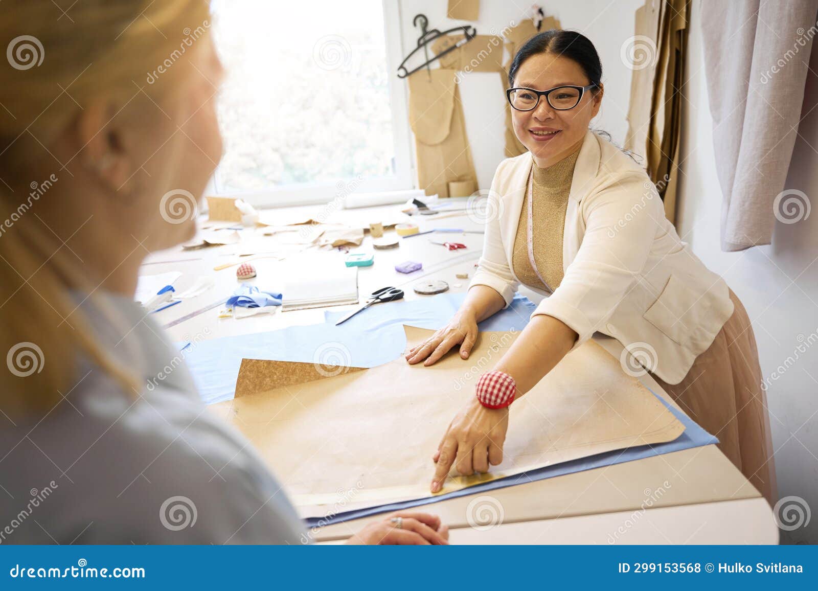 Tailoring Master Cuts Fabric According To a Pattern Stock Photo - Image ...