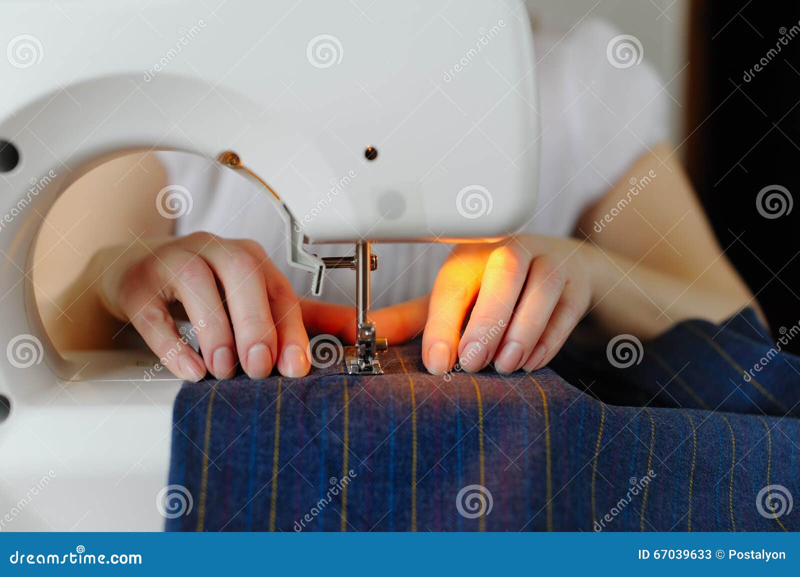 Tailoring of Natural Wool. Woman Tailor Working on Sewing Machine ...