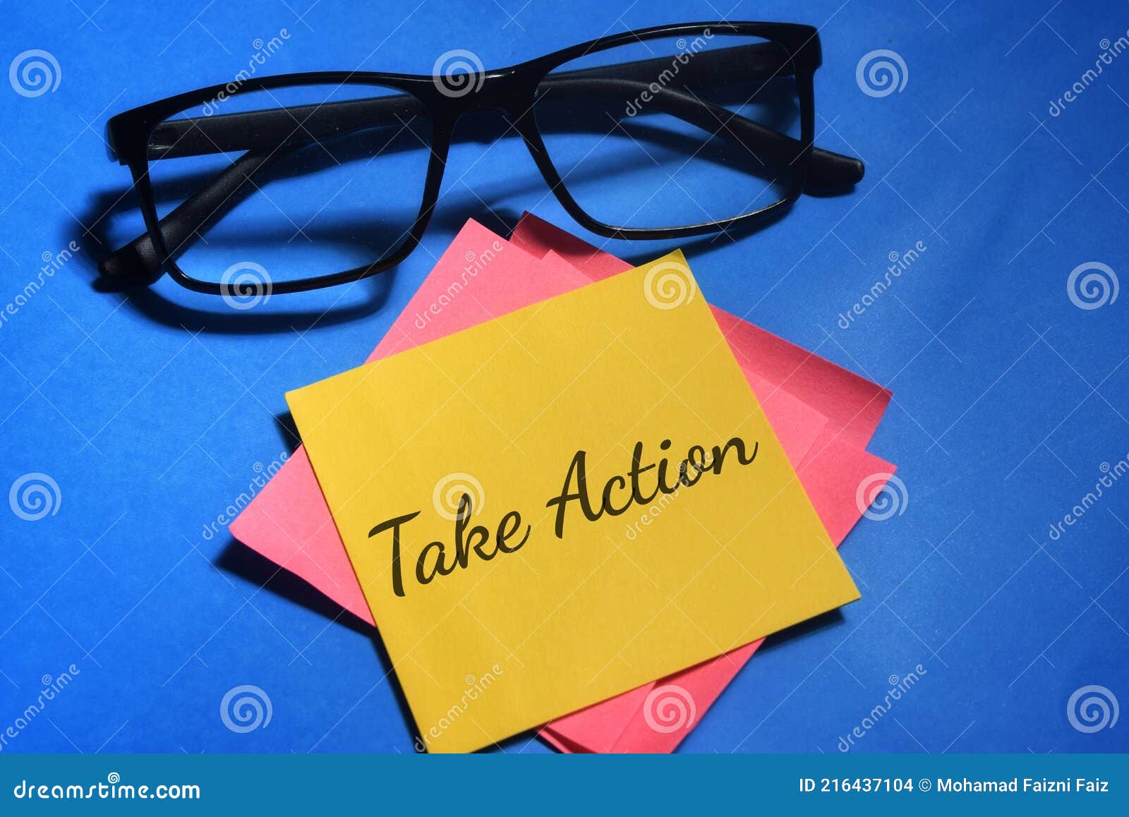 Take Action Wording with Spectacles Over a Blue Background Stock Photo ...