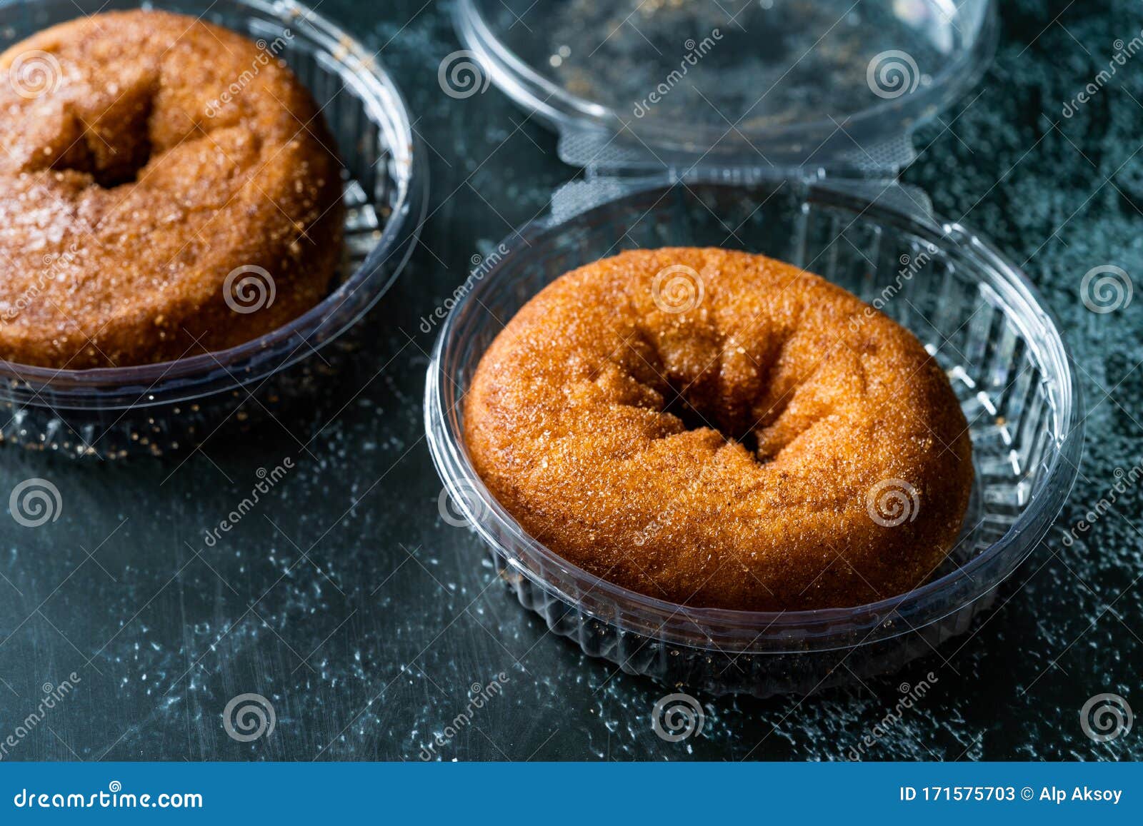 Take Away Donuts with Cinnamon in Plastic Box Package / Container Stock ...