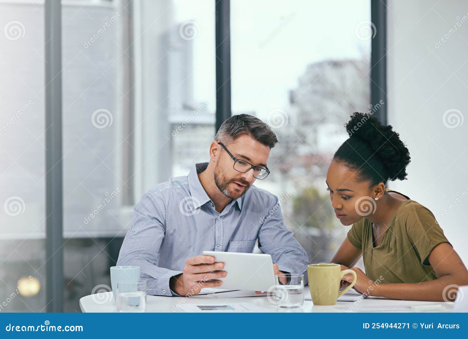 Take a Closer Look at this...two Colleagues Working Together on a ...