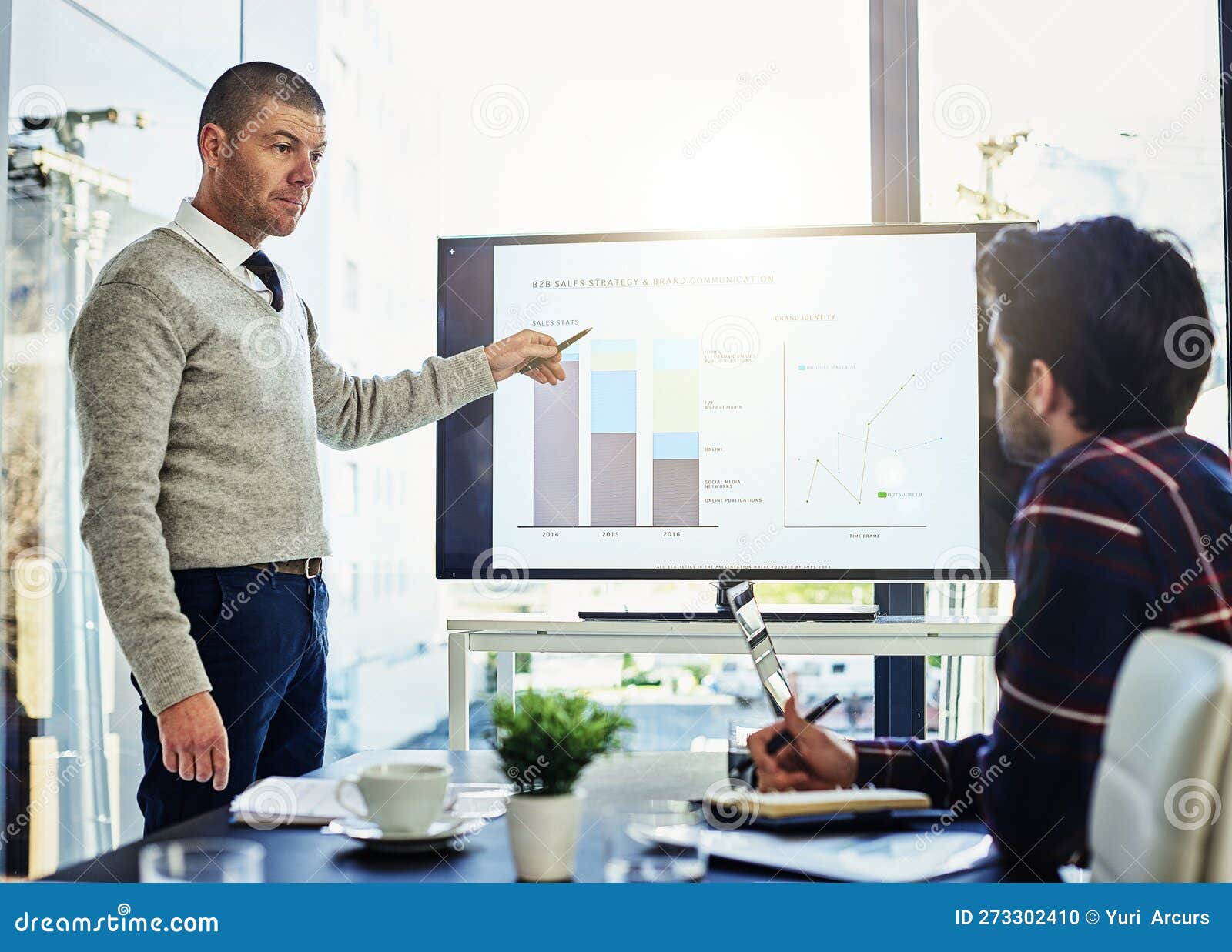 Take a Look Over Here...a Businessman Giving a Presentation in the ...