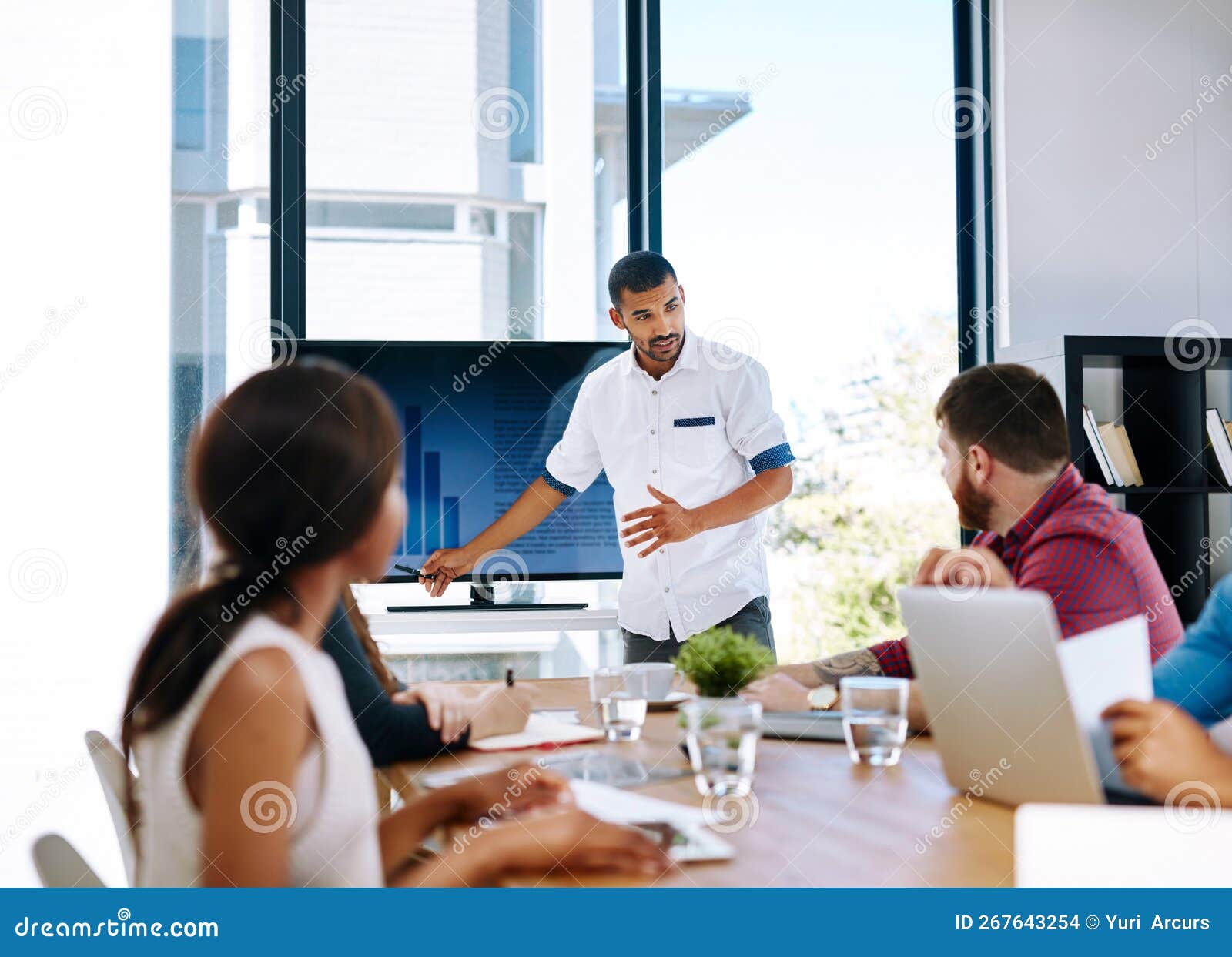 Take a Look. a Young Male Designer Giving a Presentation in the ...