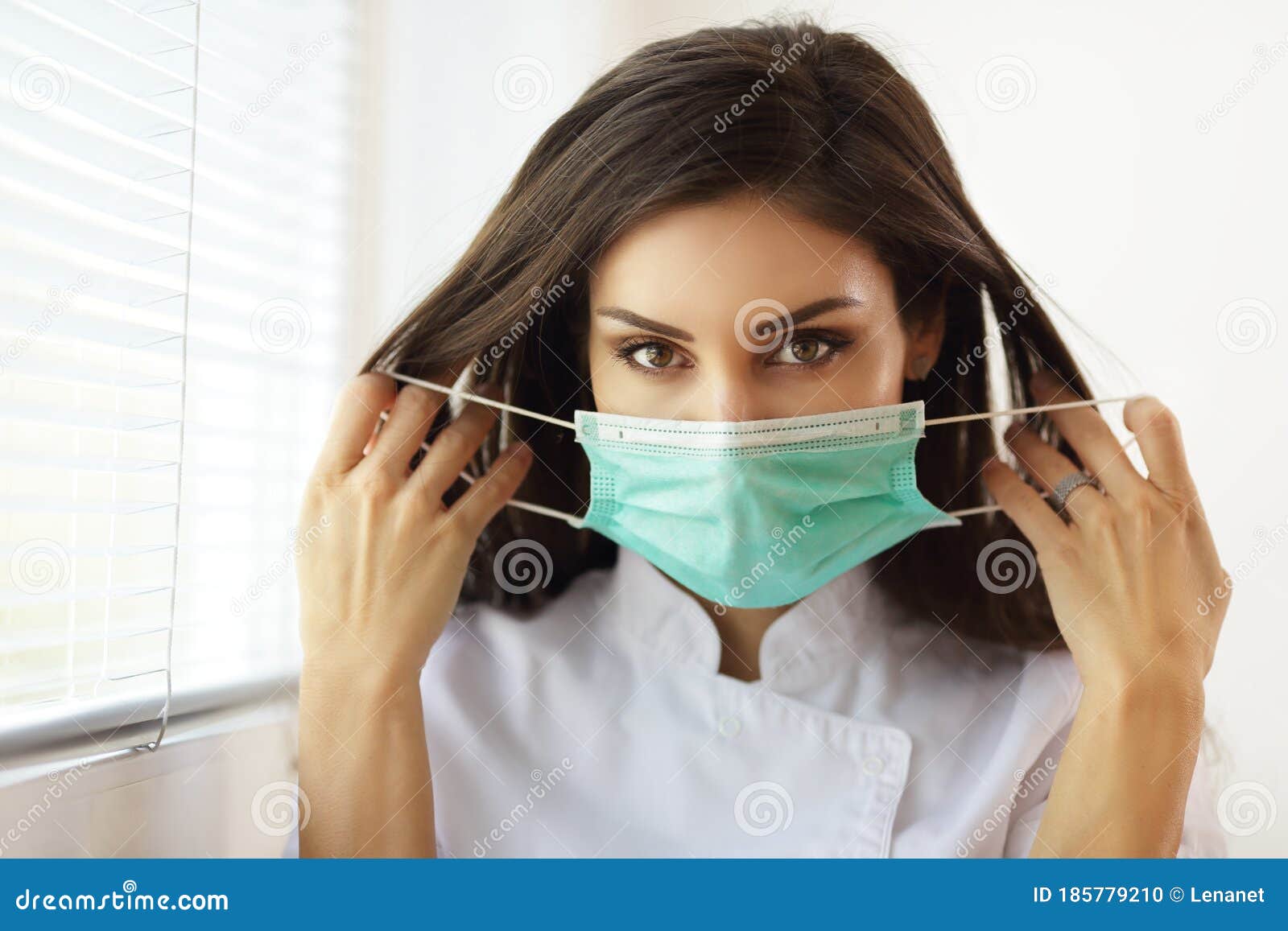 Take off protecting mask stock photo. Image of hands - 185779210