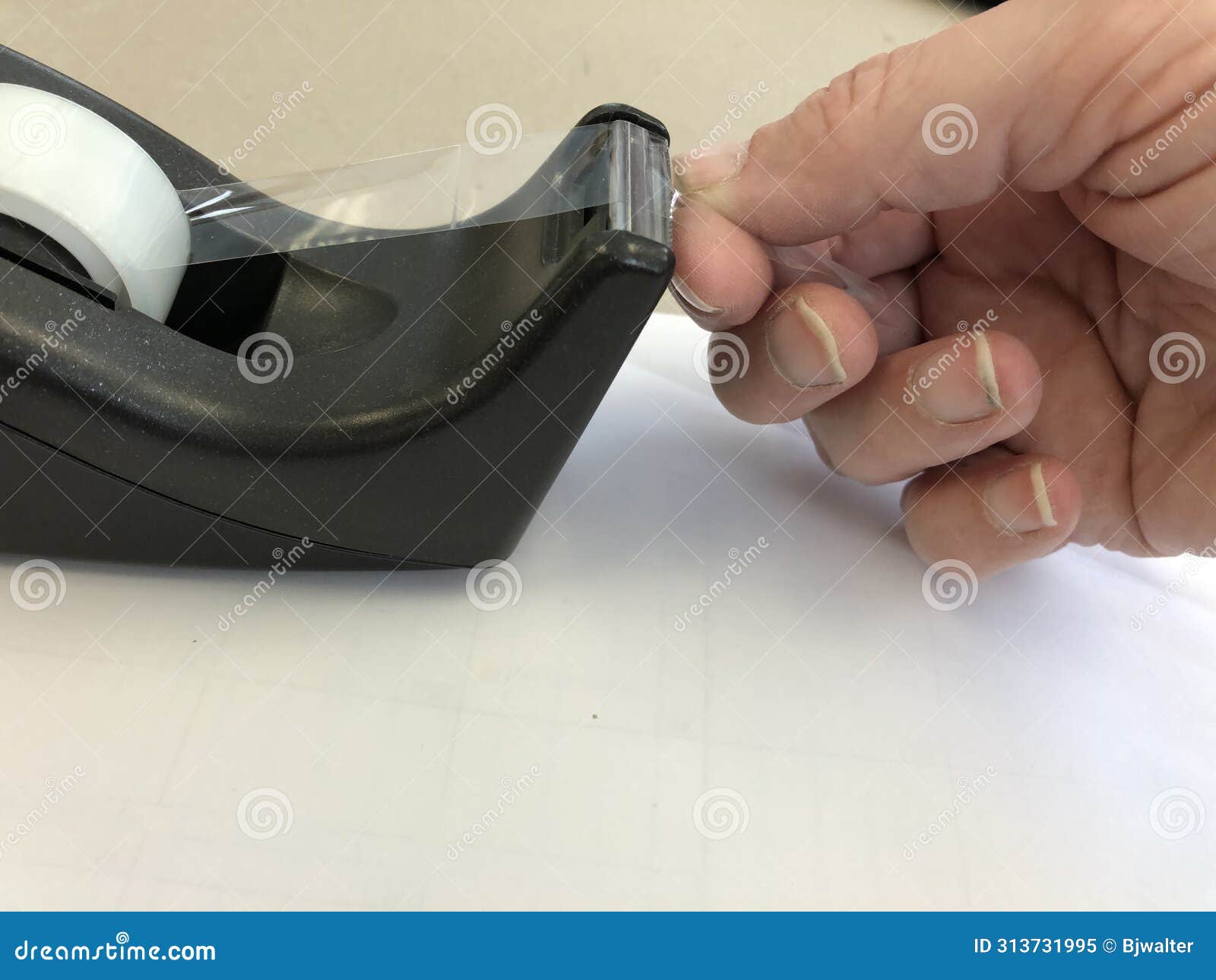 Pulling Tape from a Tape Dispenser. Stock Image - Image of finger, limb ...
