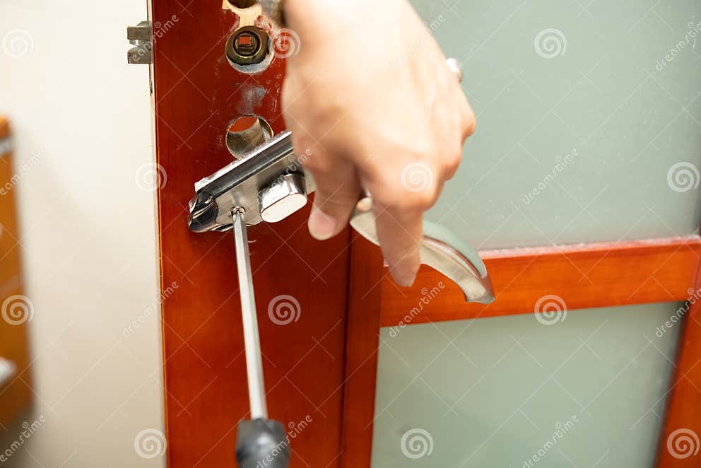 Taking apart door lock stock image. Image of handyman - 229344875