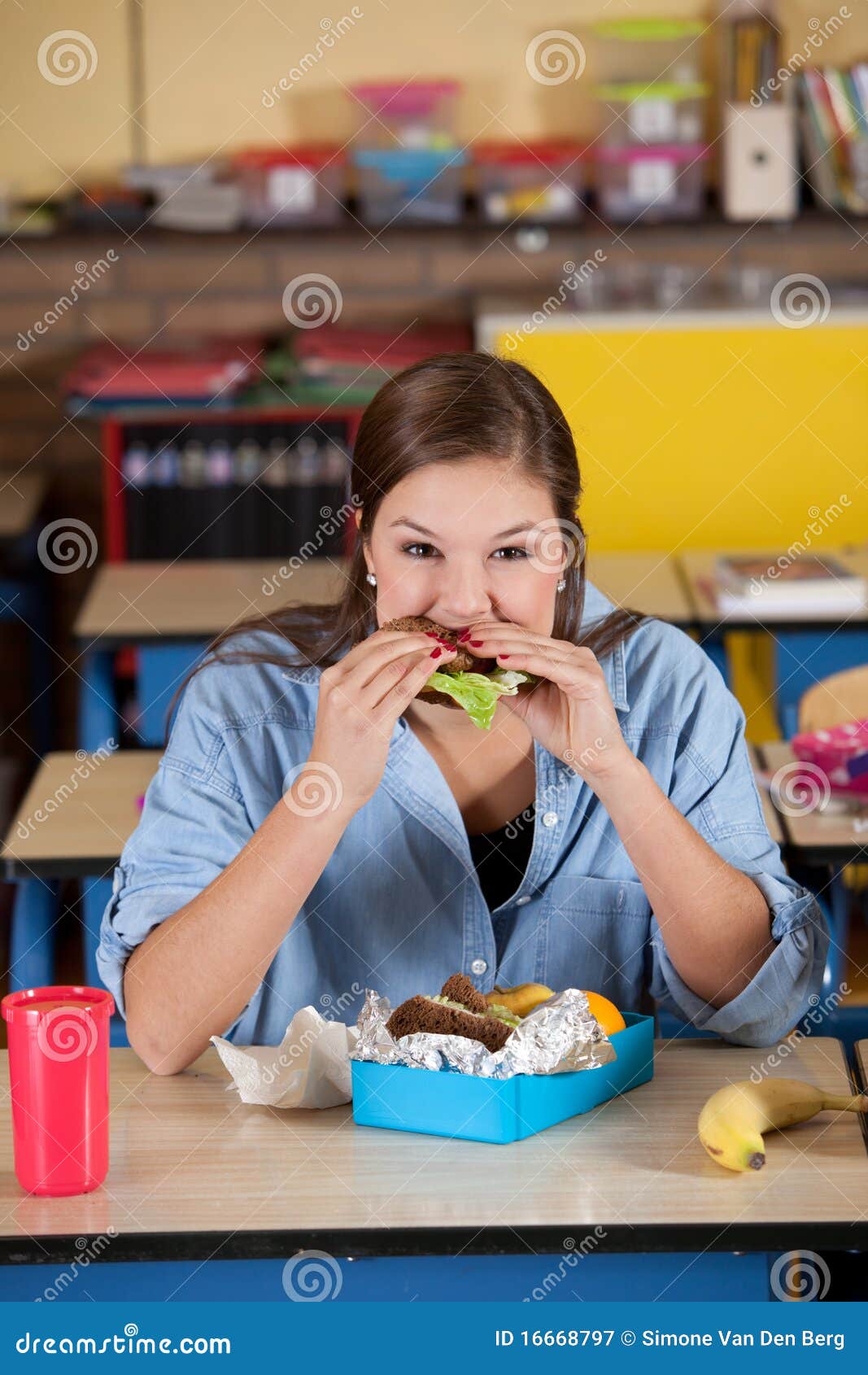 Taking a bite stock image. Image of schoolgirls, lunchbox - 16668797