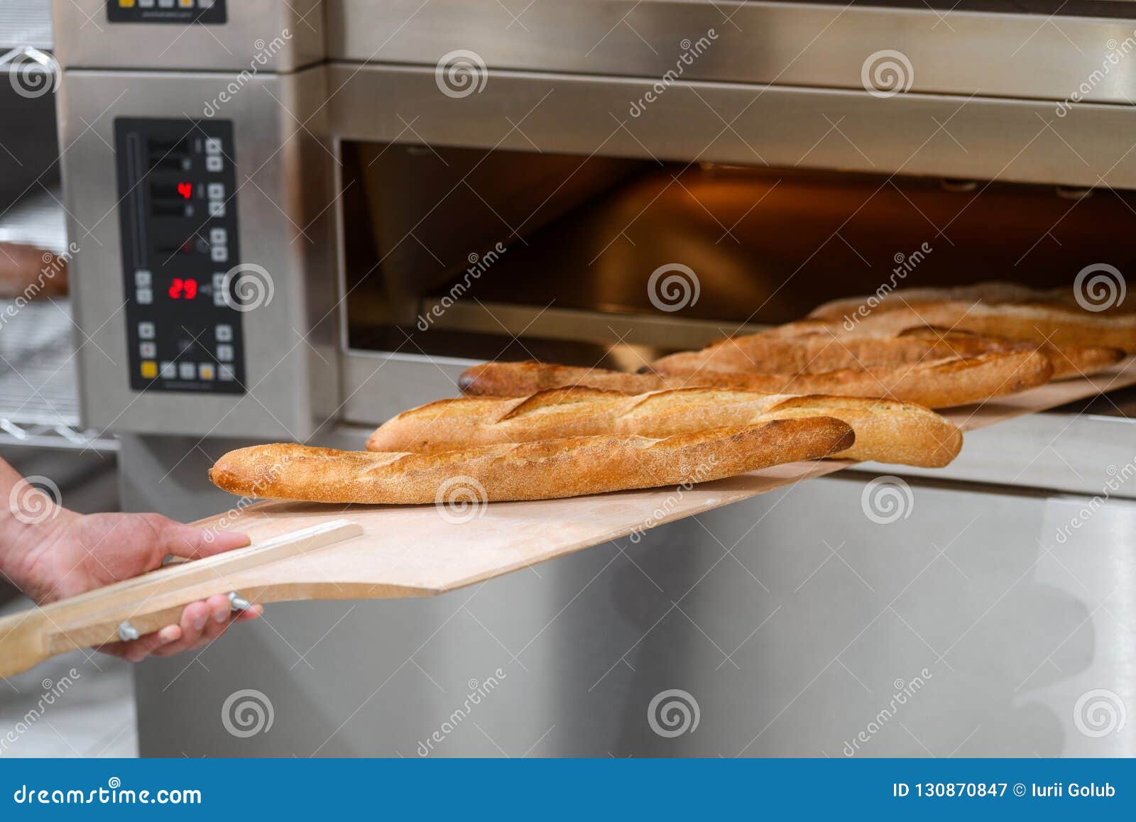 Taking Bread Out Oven Stock Images - Download 198 Royalty Free Photos