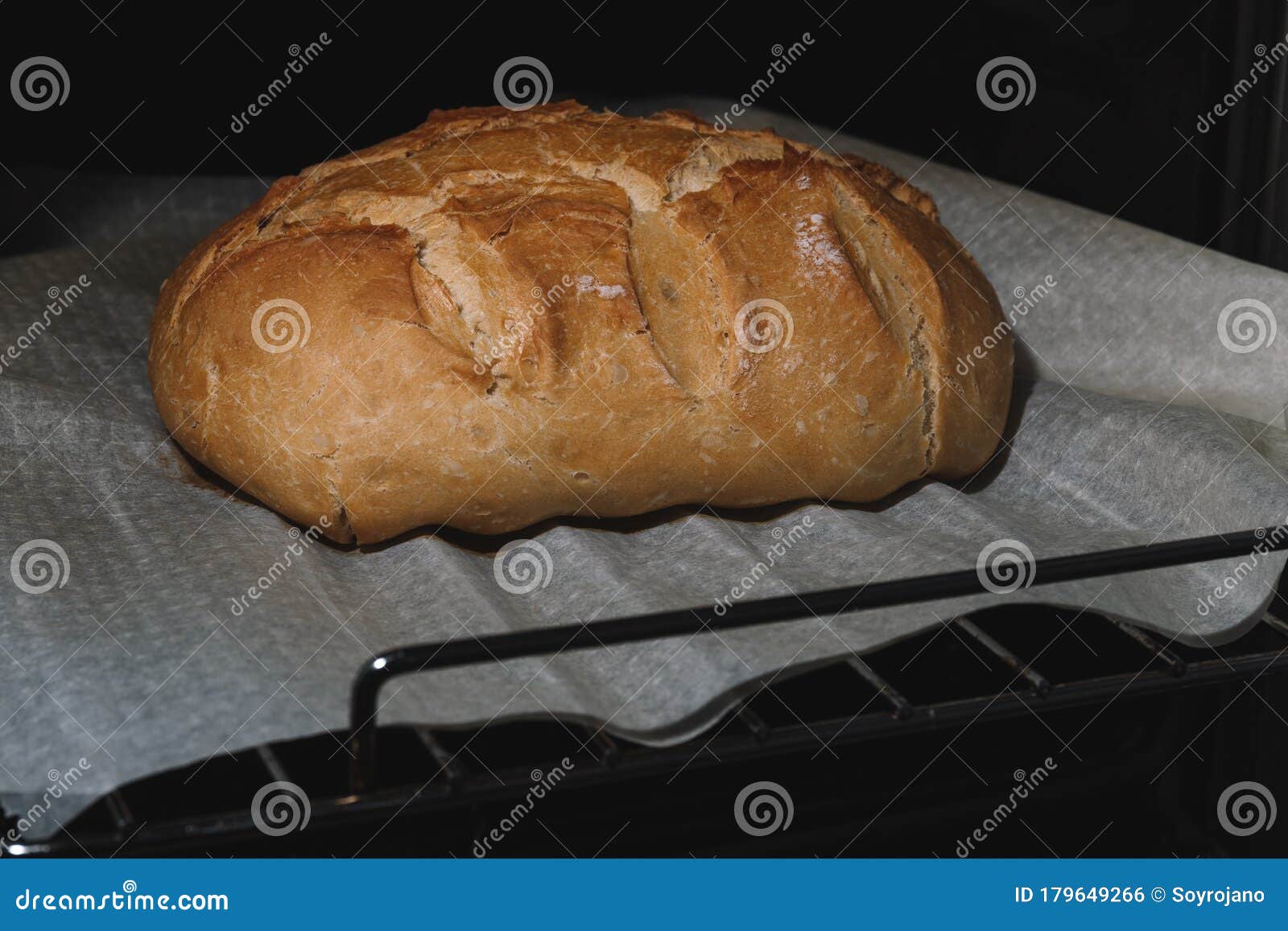 Taking the Bread Out of the Oven Freshly Made Stock Photo - Image of ...