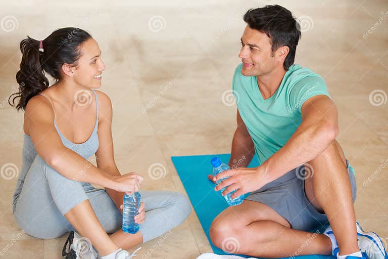 Taking a Break between Exercise Routines. a Young Couple Taking a Break ...