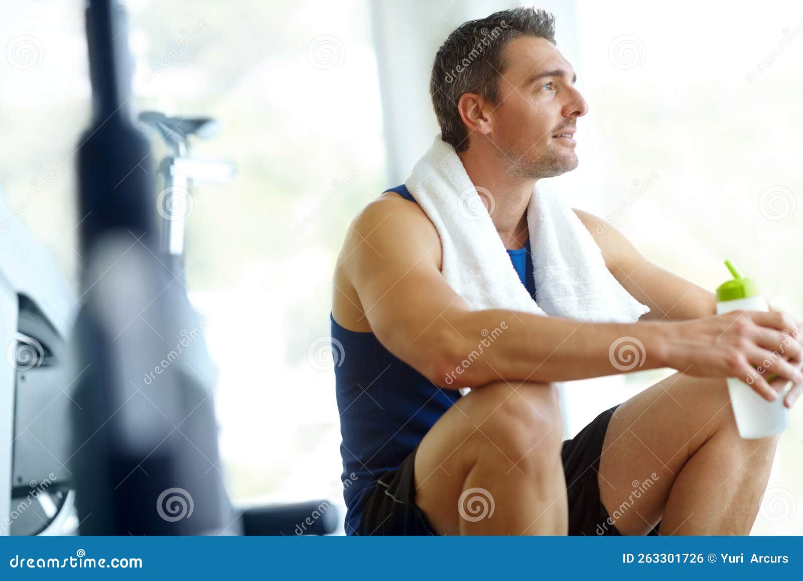 Taking a Break between Sessions. a Handsome Man Sitting at the Gym ...