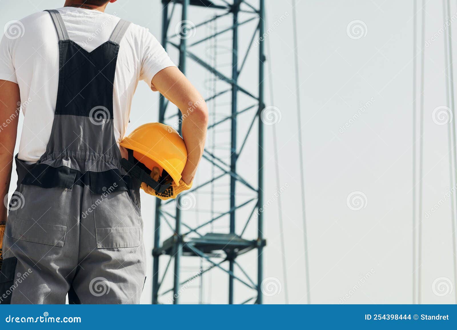 Taking a Break. Young Construction Worker in Uniform is Busy at the ...