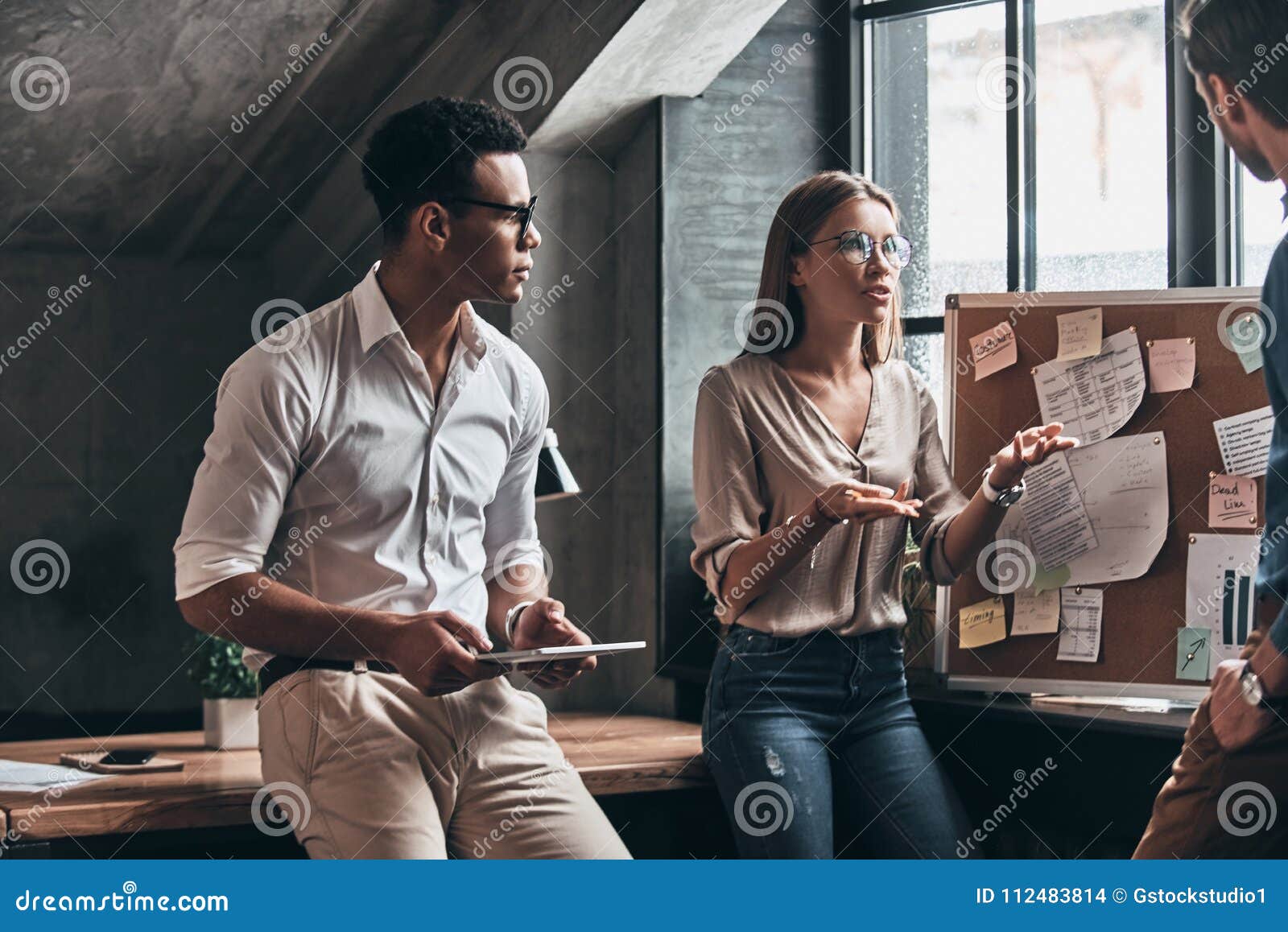Taking Care of Business. Group of Young Business People Discussi Stock ...