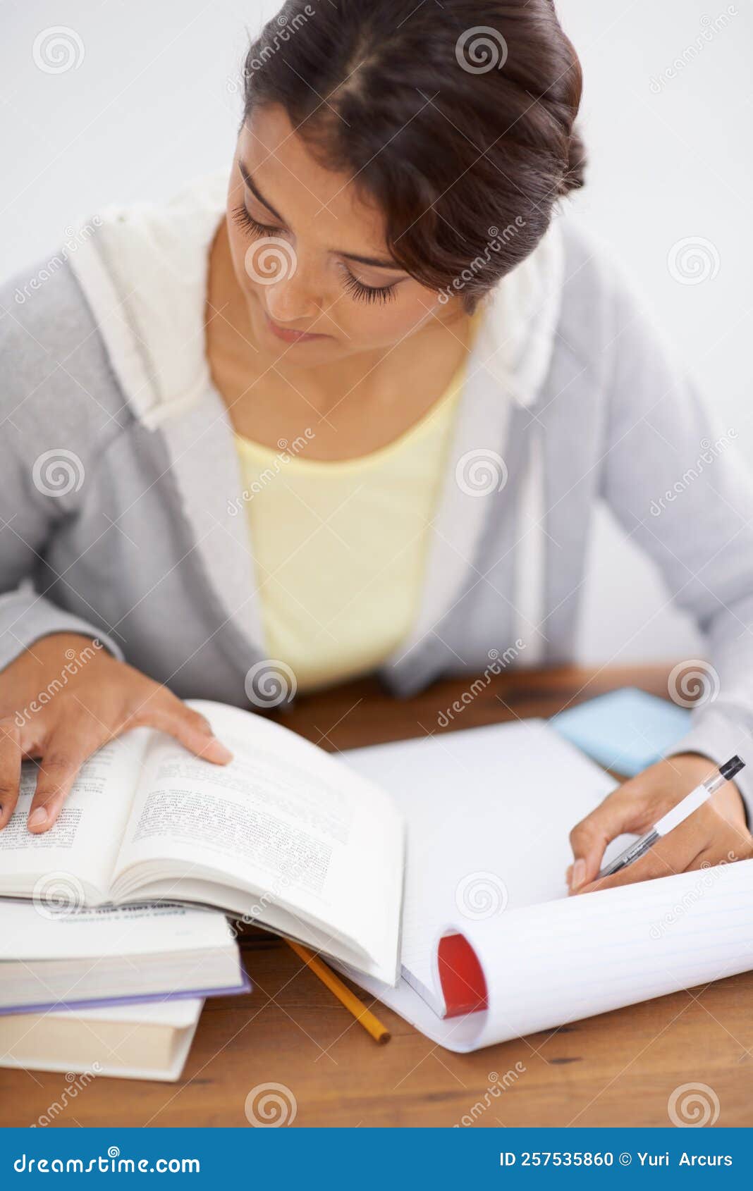 Taking Down Some Important Notes. Closeup Shot of a Pretty College ...