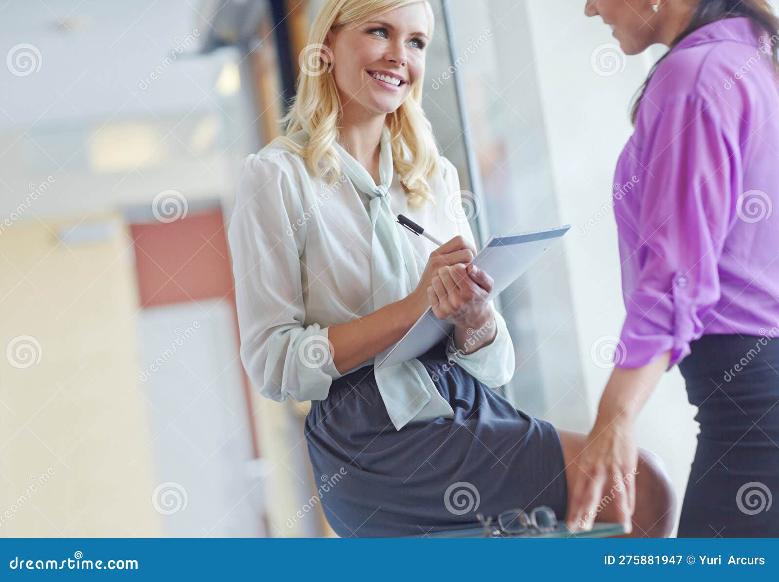 Taking Down Some Important Notes. Work Colleagues Writing Down Notes ...