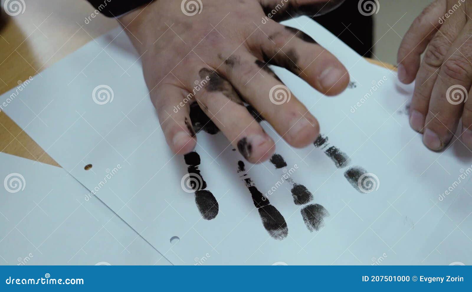 Taking Fingerprints and Handprints on a White Sheet in a Forensics ...