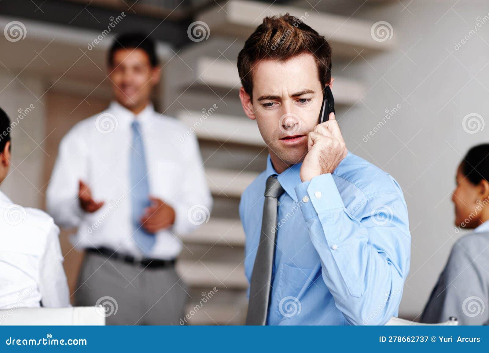 Taking an Important Call during a Presentation. a Young Executive ...