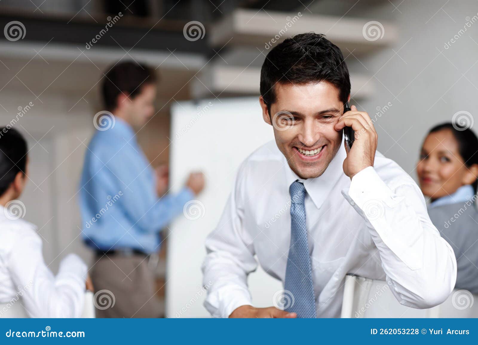 Taking an Important Client Call. a Young Executive Taking a Call during ...
