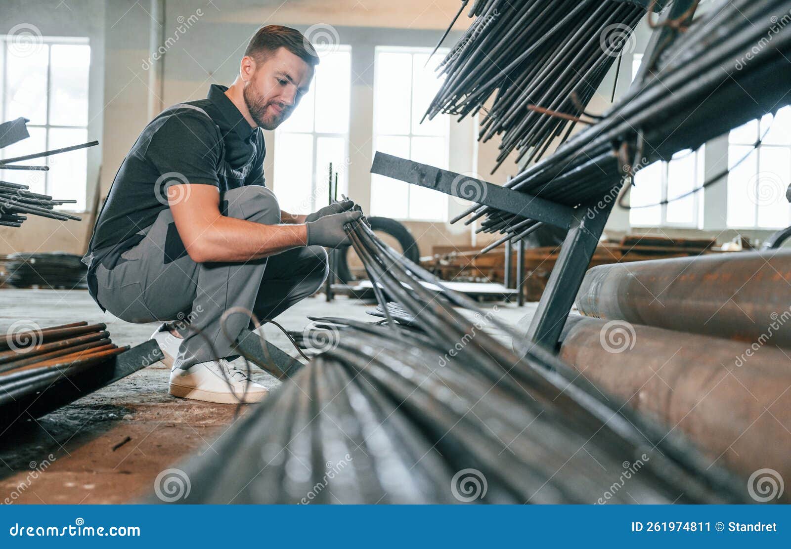 Taking Metal Pieces. Man in Uniform is in Workstation Developing ...