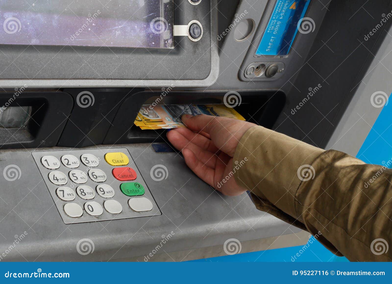 Taking money from an ATM stock photo. Image of bonus - 95227116