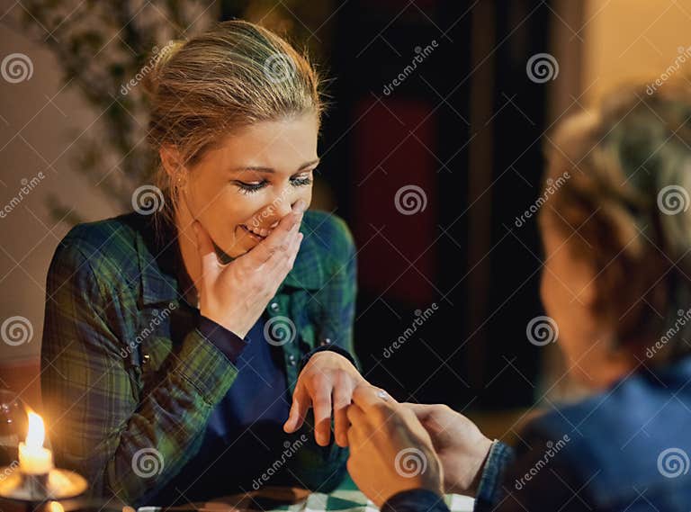 Taking the Next Step in Their Relationship. a Young Man Proposing To ... Taking the Next Step in Their Relationship. a Young Man Proposing To ...