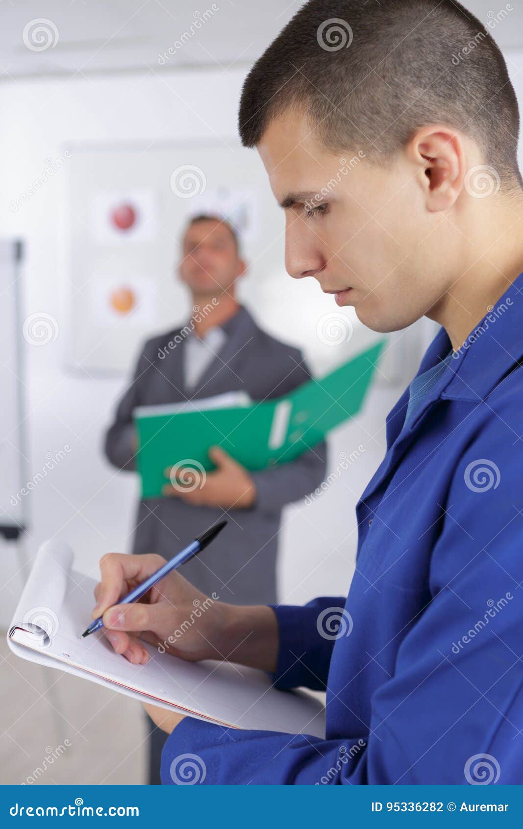 Taking notes during class stock photo. Image of work - 95336282