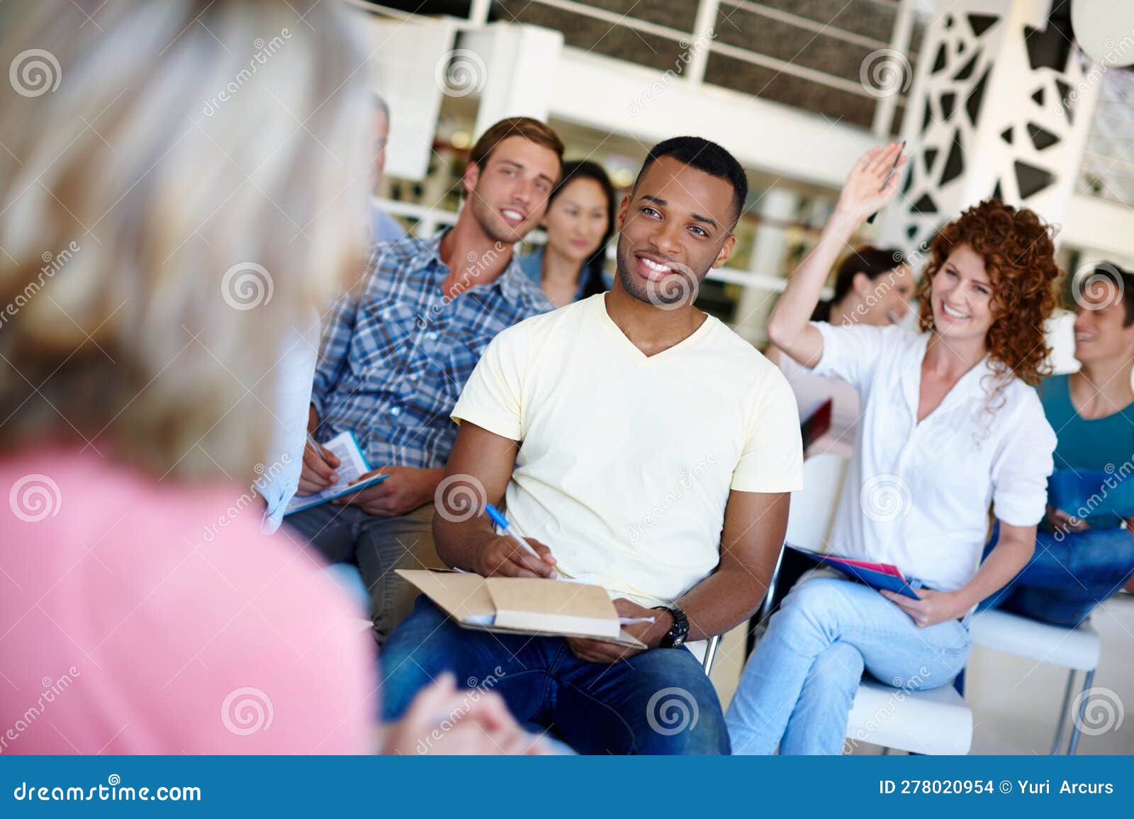 Taking Notes To Remember it All. Woman Asking a Question during a ...