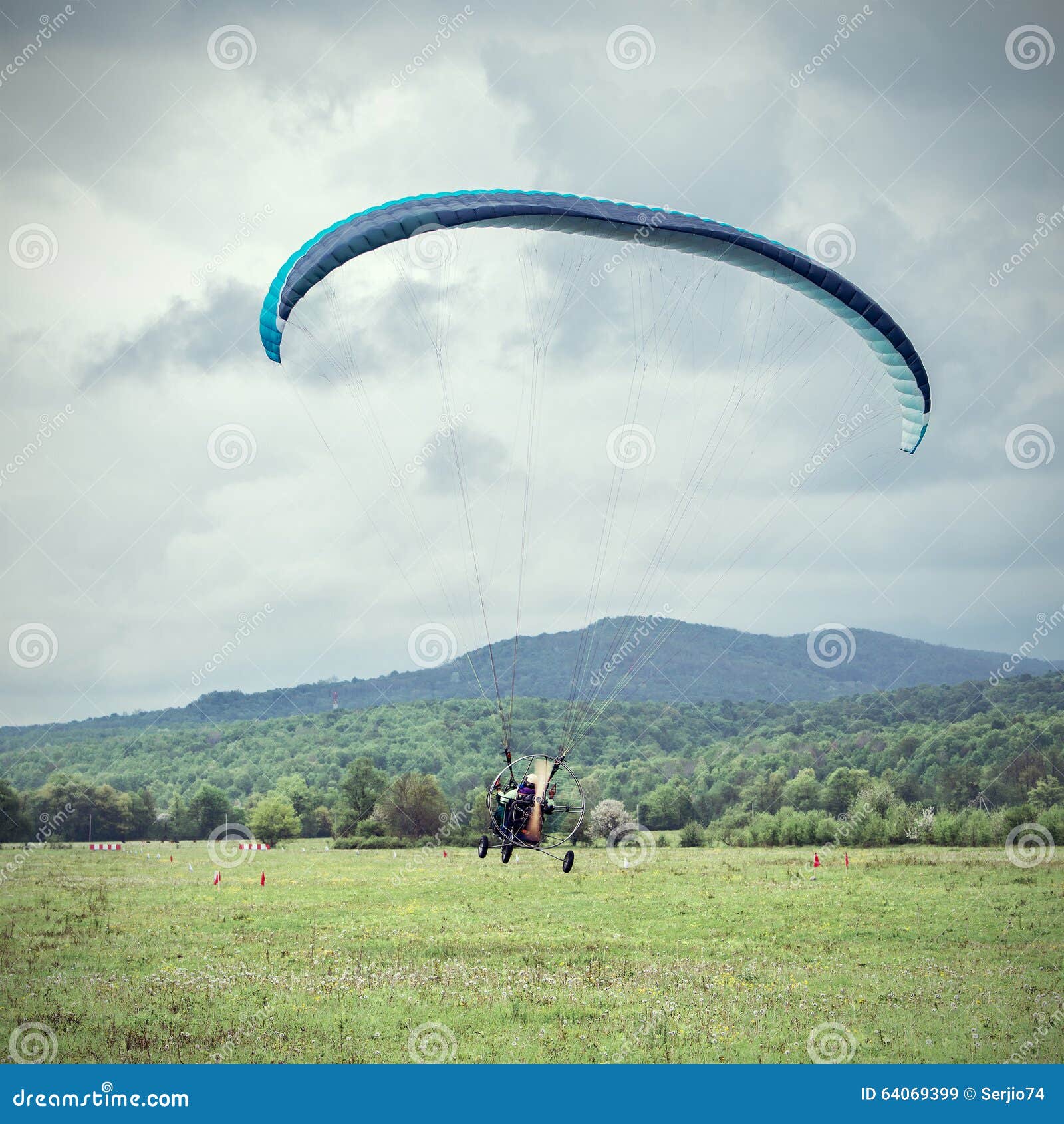 Taking off the paraglider. stock image. Image of freedom - 64069399
