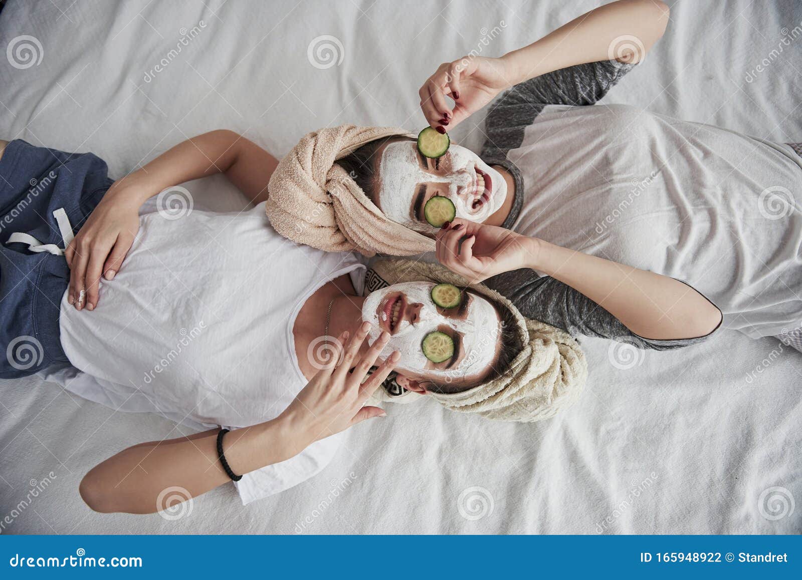 Taking Off these Things. Lying on the White Bed. Top View Stock Photo ...