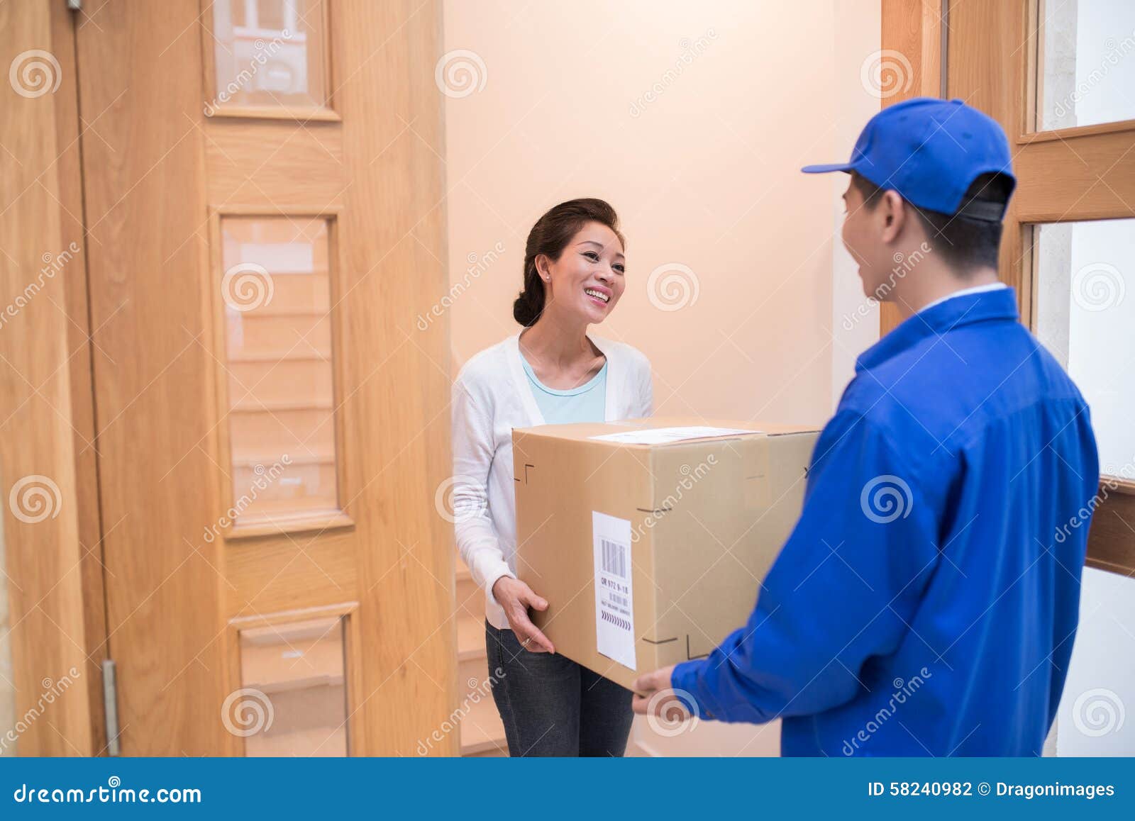 Taking parcel to the house stock photo. Image of postman - 58240982