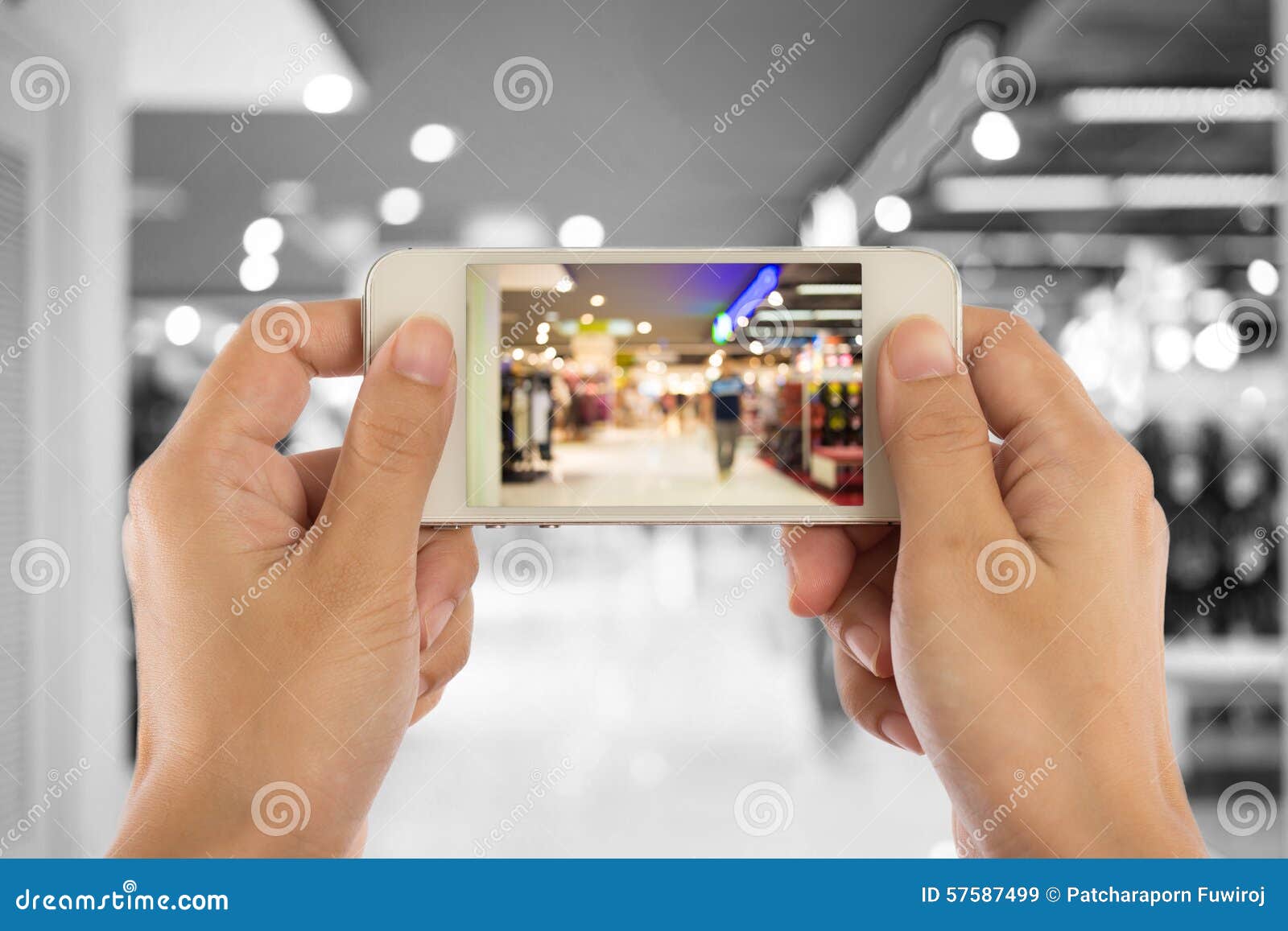 Taking a Picture with a Smart Phone in Shopping Mall. Stock Image ...