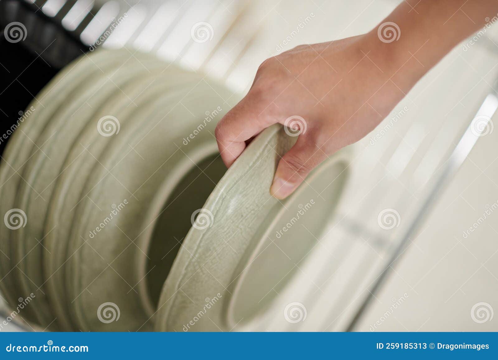 Taking Plate from Dish Drying Rack Stock Image - Image of tableware ...