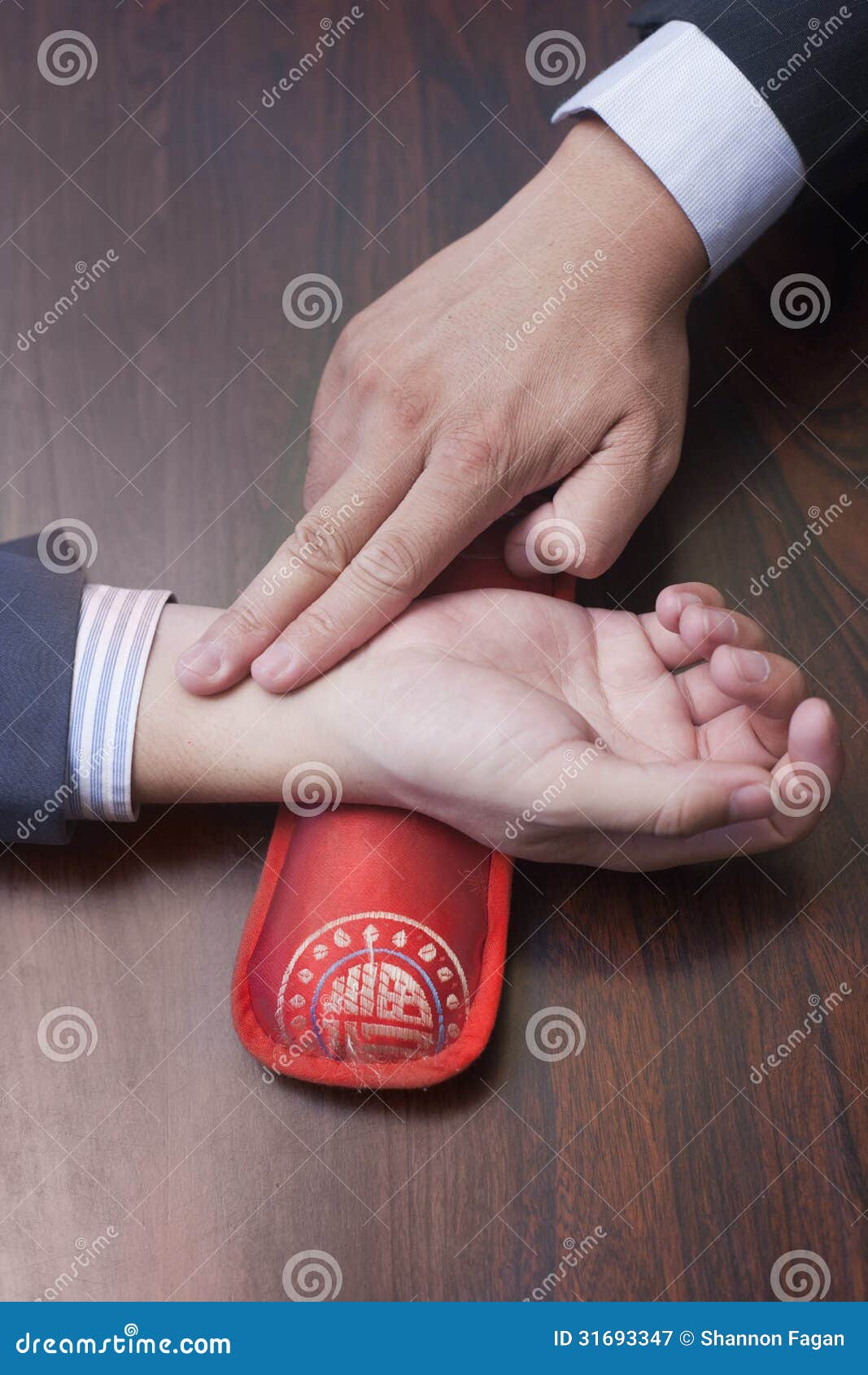 Taking Pulse stock image. Image of hand, china, indoors - 31693347