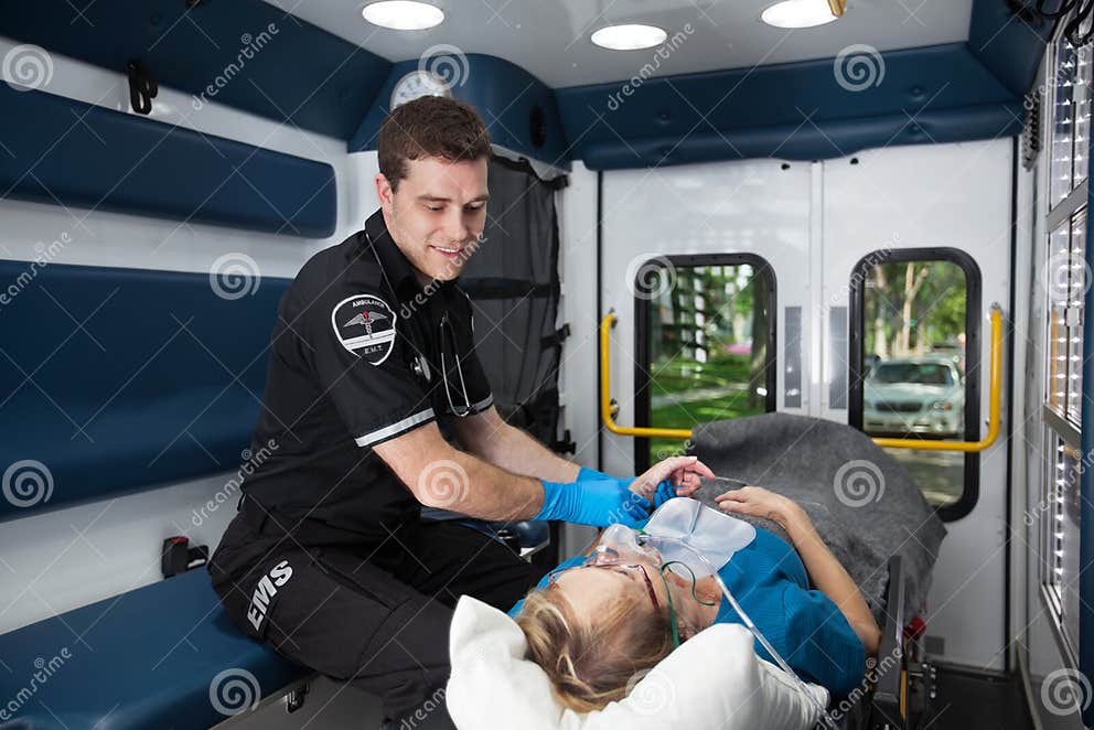 Taking Pulse in Ambulance stock photo. Image of care - 21813380