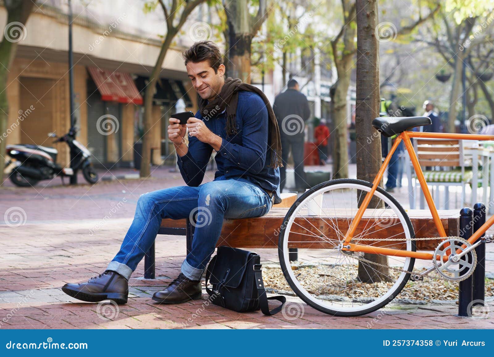 Taking a Quick Break. a Handsome Young Bike-traveler. Stock Photo ...