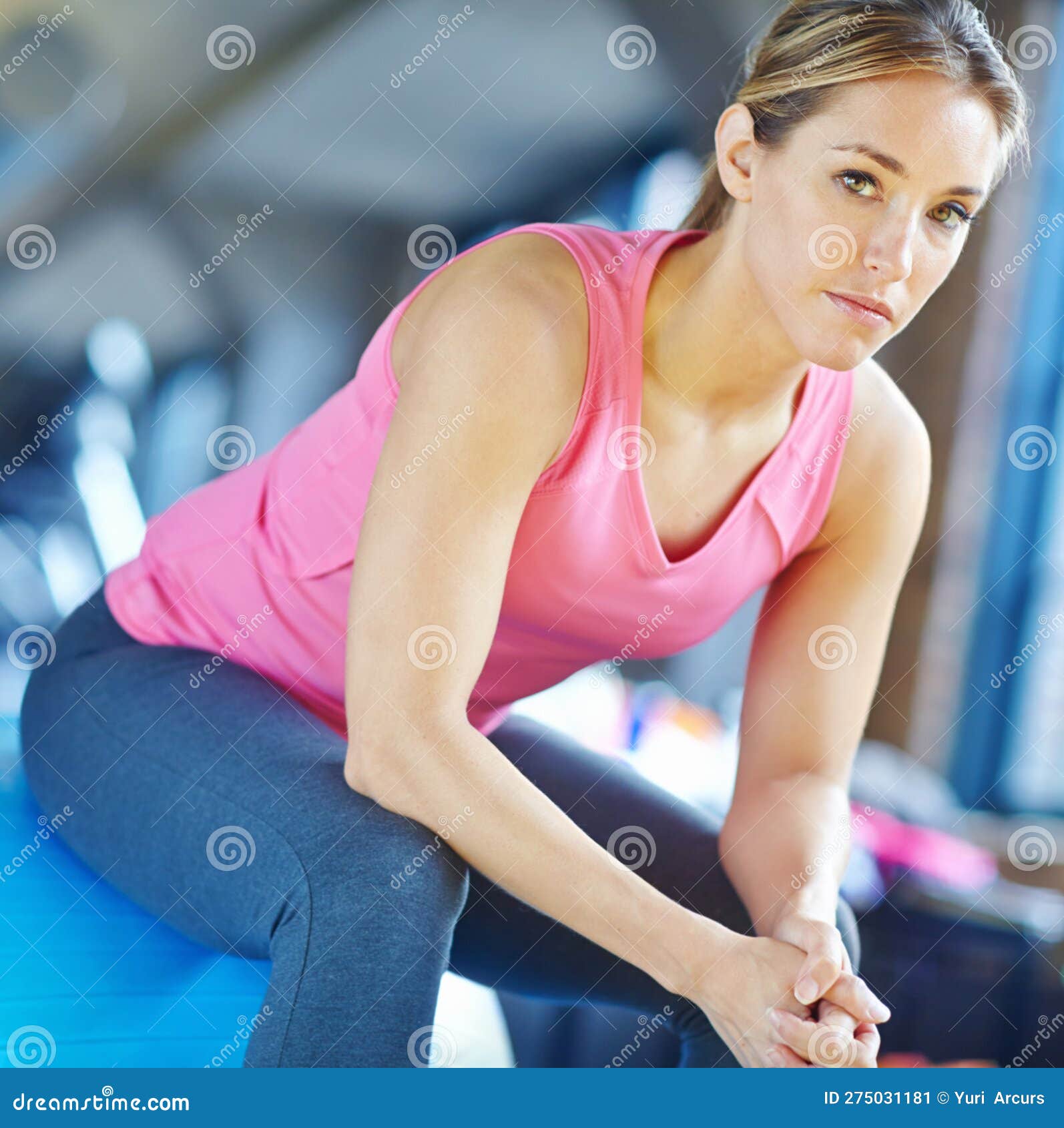 Taking a Quick Break between Workouts. a Young Woman Resting after Her ...