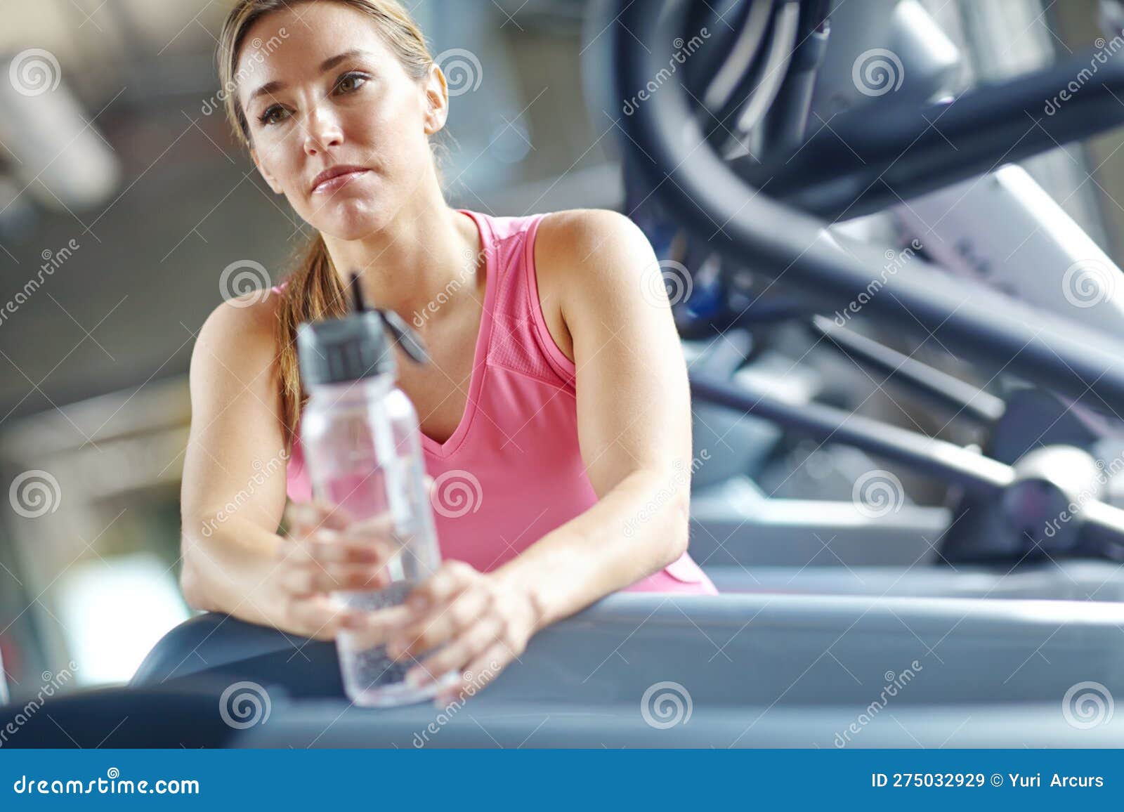 Taking a Quick Break between Workouts. a Young Woman Resting after Her ...