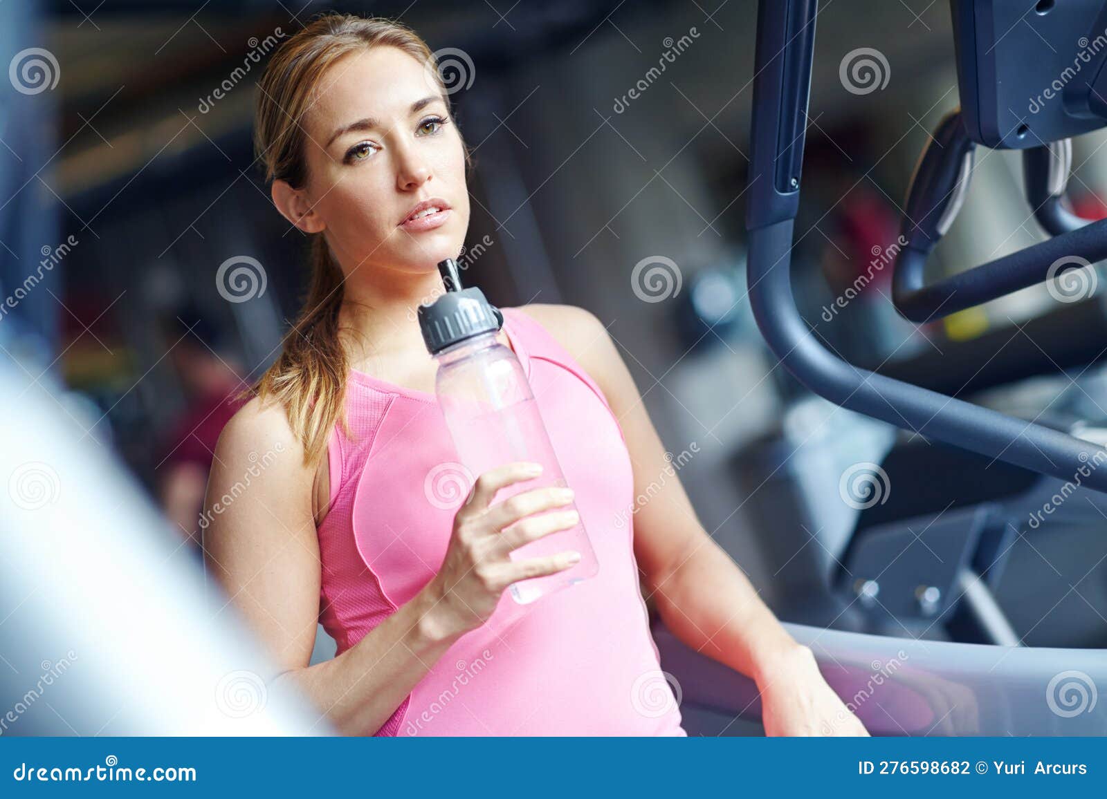 Taking a Quick Break between Workouts. a Young Woman Resting after Her ...