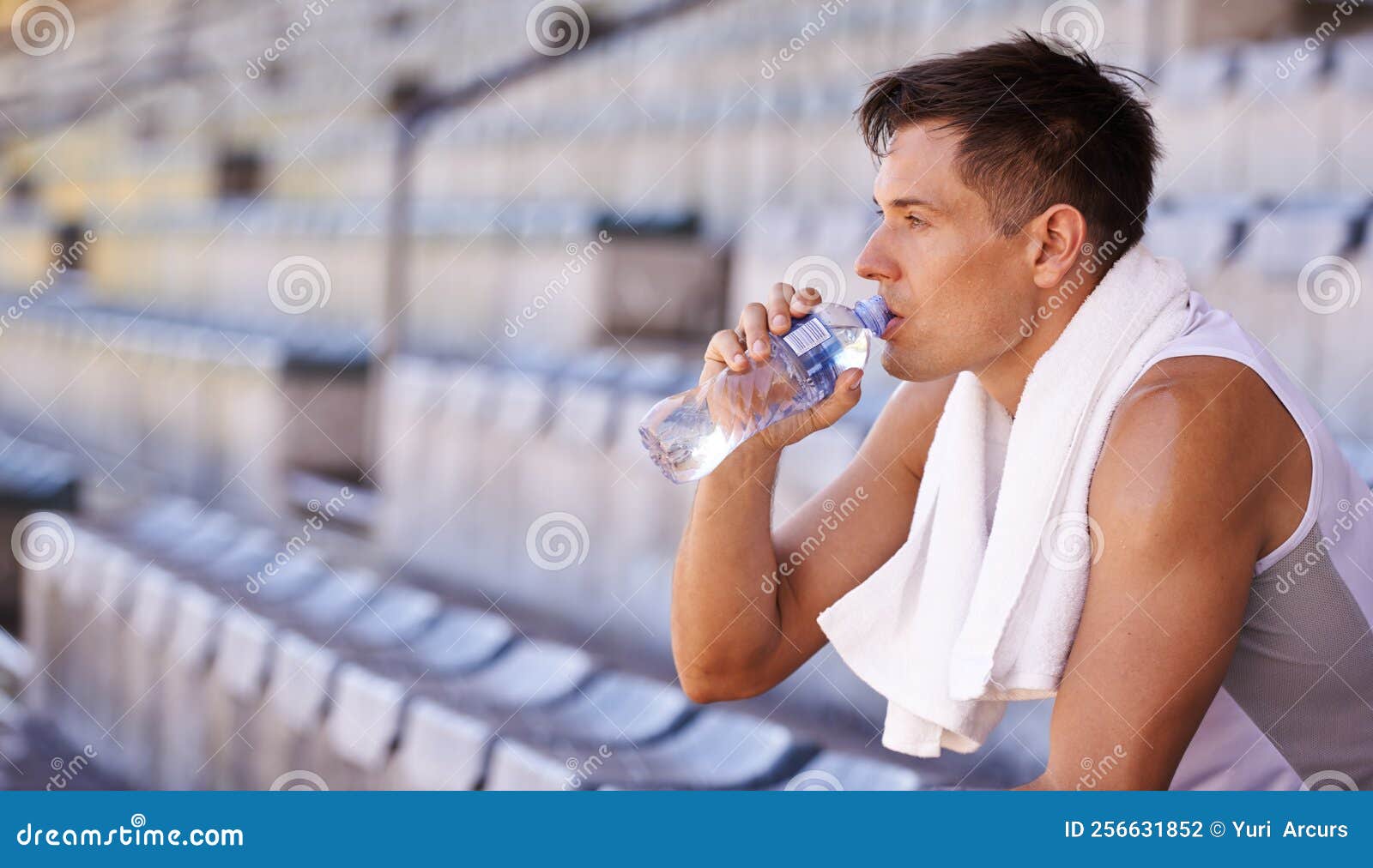 Taking a Refreshment Break. an Athlete Taking a Break from Training ...